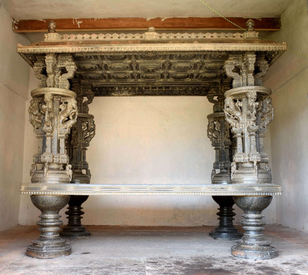 Carved bed stead of stone existing in a small chamber in the south side ...